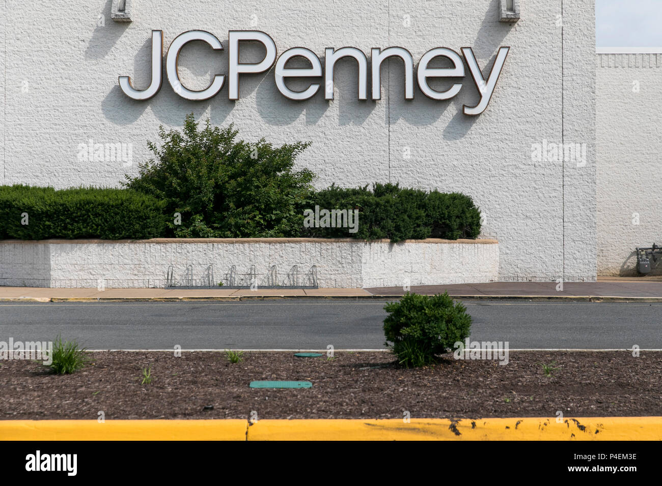 A logo sign outside of a JCPenney retail store in Fredericksburg ...