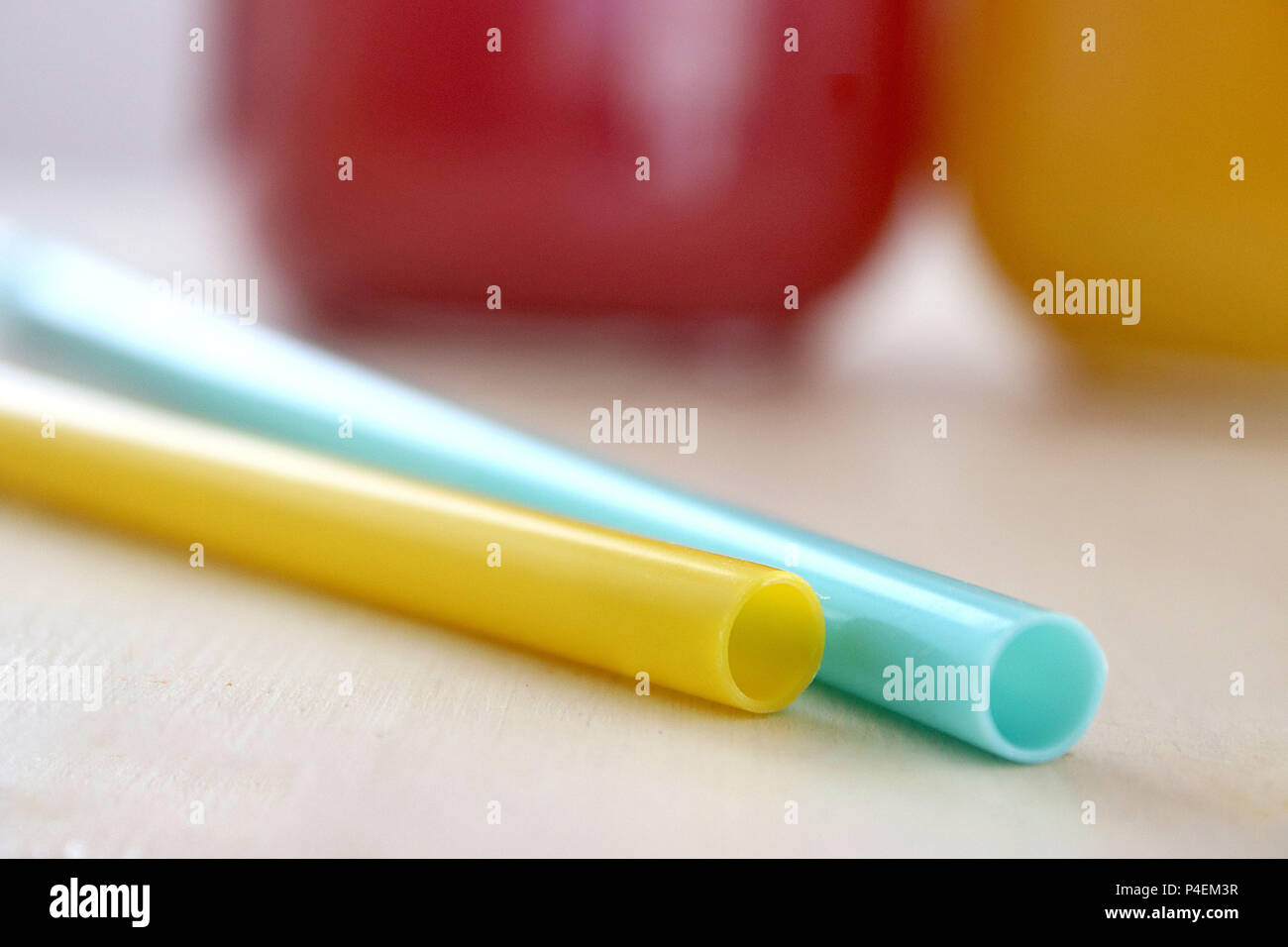 Two drinking straws next to fruit juice Stock Photo - Alamy
