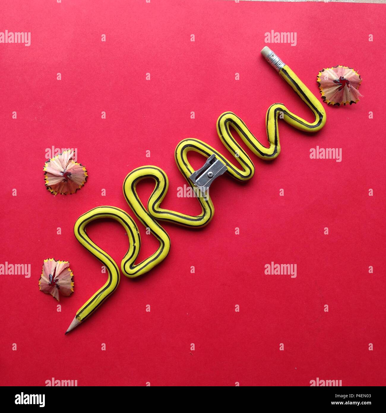 The word draw made from a bending pencil Stock Photo - Alamy