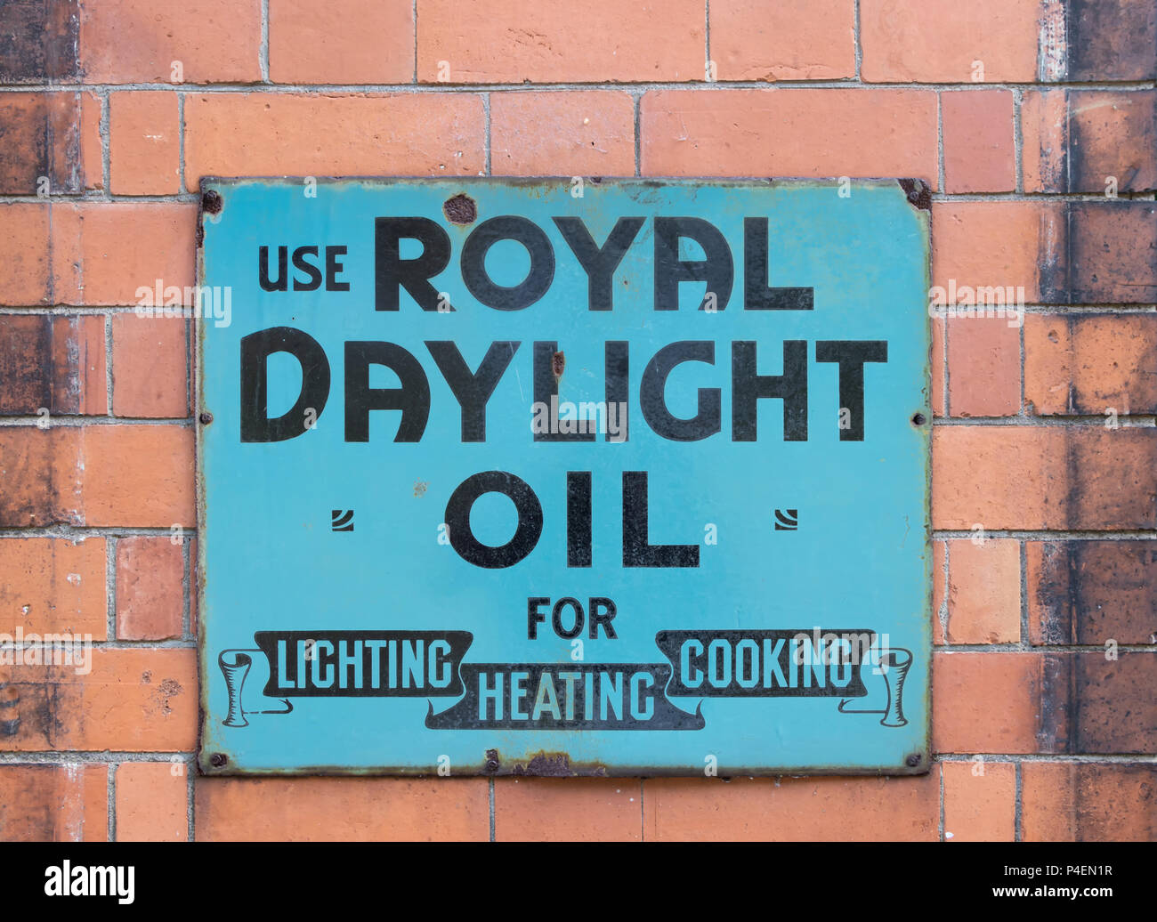 old enamel Royal Daylight Oil sign on a wall in Leicestershire, United ...