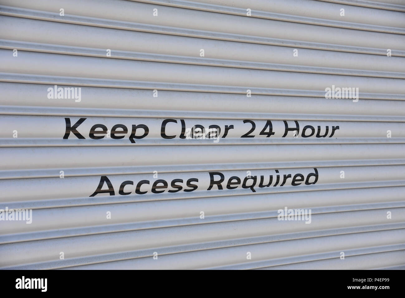 Keep Clear 24 Hour Access Required sign Stock Photo - Alamy