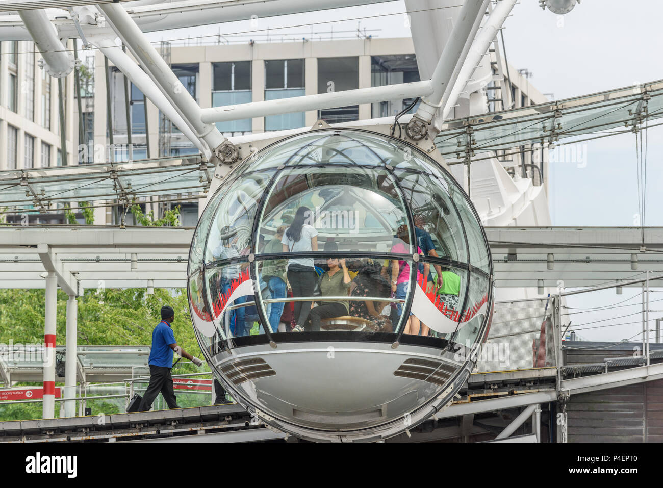 People in a pod at the lower end of the London Eye ferris wheel at ...