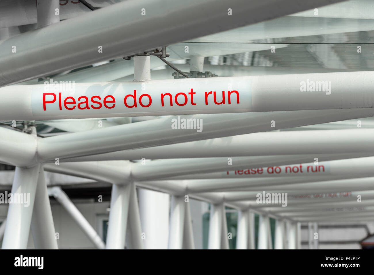 'Please do not run' notice on the pier from the London Eye ferris wheel ...