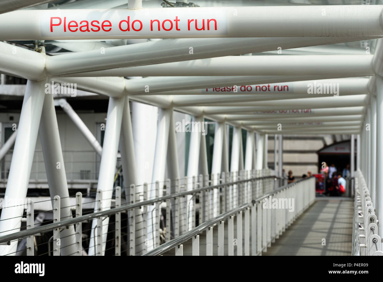 'Please do not run' notice on the pier from the London Eye ferris wheel ...
