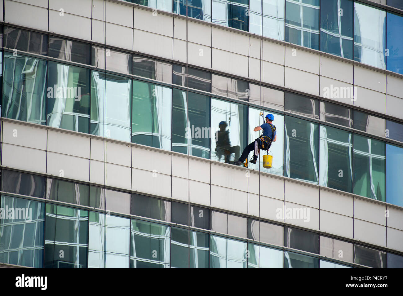 Windows cleaning in skyscraper office building in Warsaw, Poland. May ...