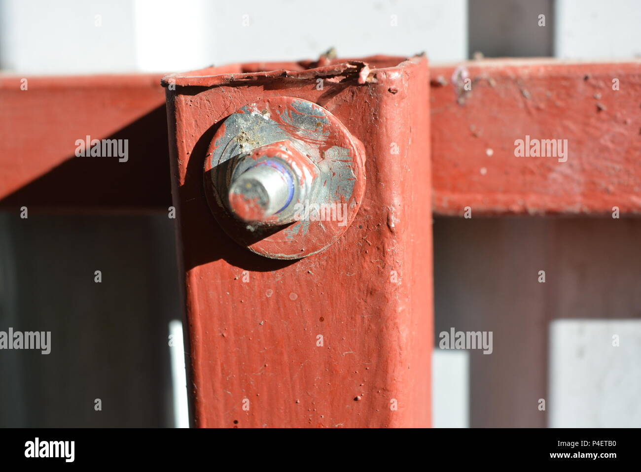 The metallic profile of the gray color is fixed to the pipe, which is ...