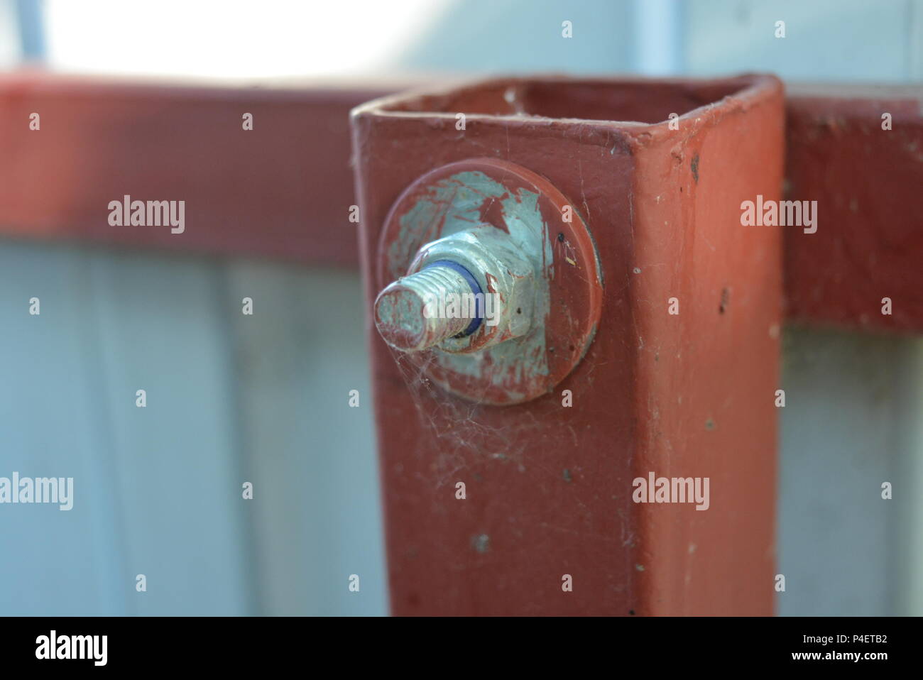 The metallic profile of the gray color is fixed to the pipe, which is ...