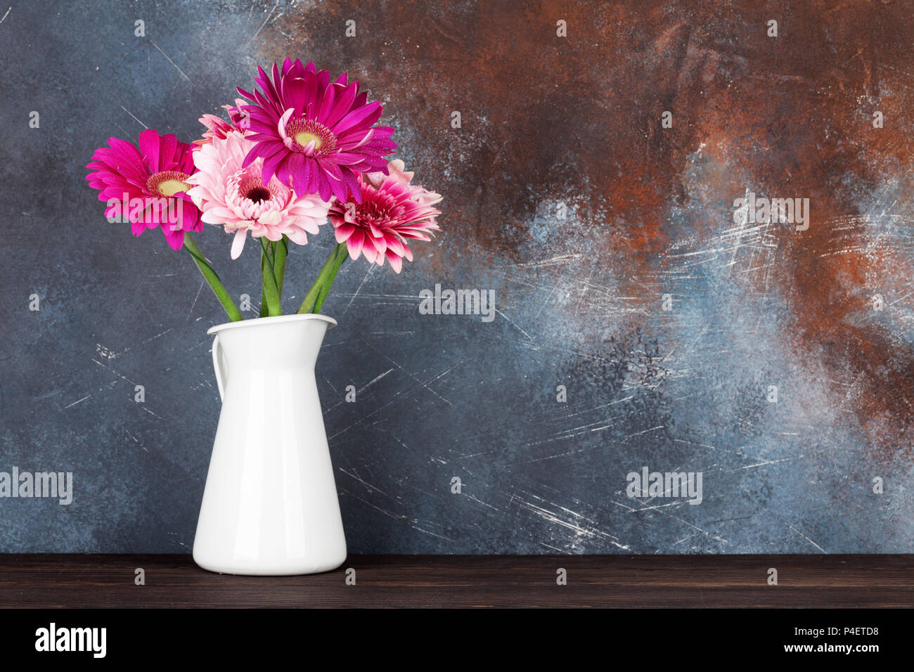 Gerbera flowers in front of stone wall. With space for your text Stock ...