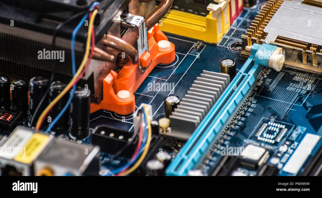 Motherboard with visible PCI express connector slot, heat sink, memory ...