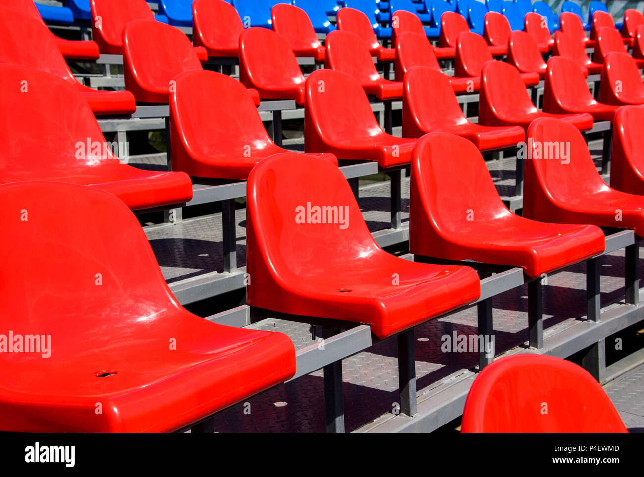 Plastic seats on stadium Stock Photo - Alamy