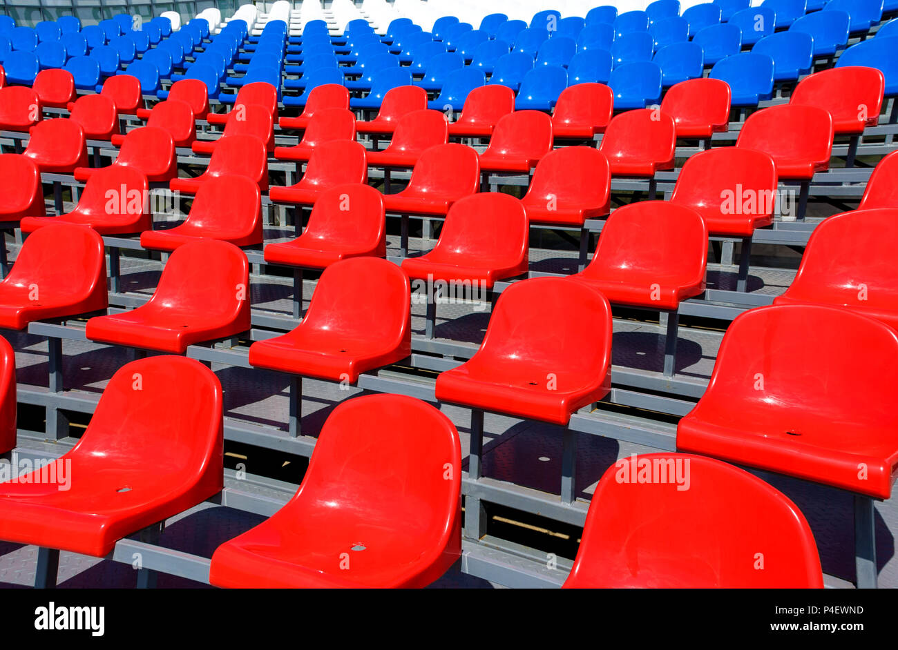 Plastic seats on stadium Stock Photo - Alamy