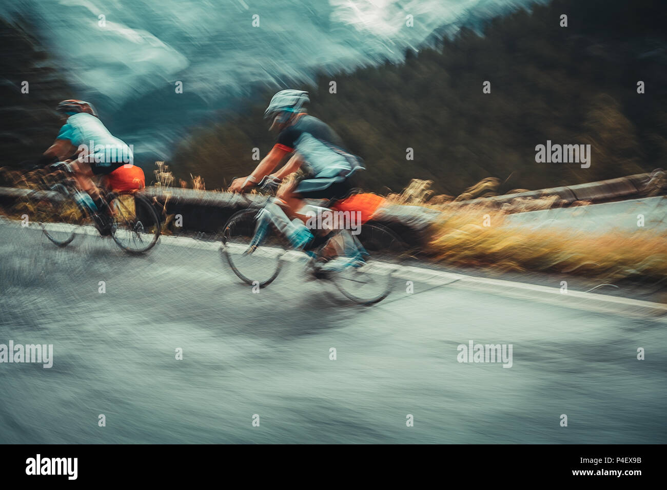 Slow motion photo of a two sportsmans riding bicycles, cycling ...