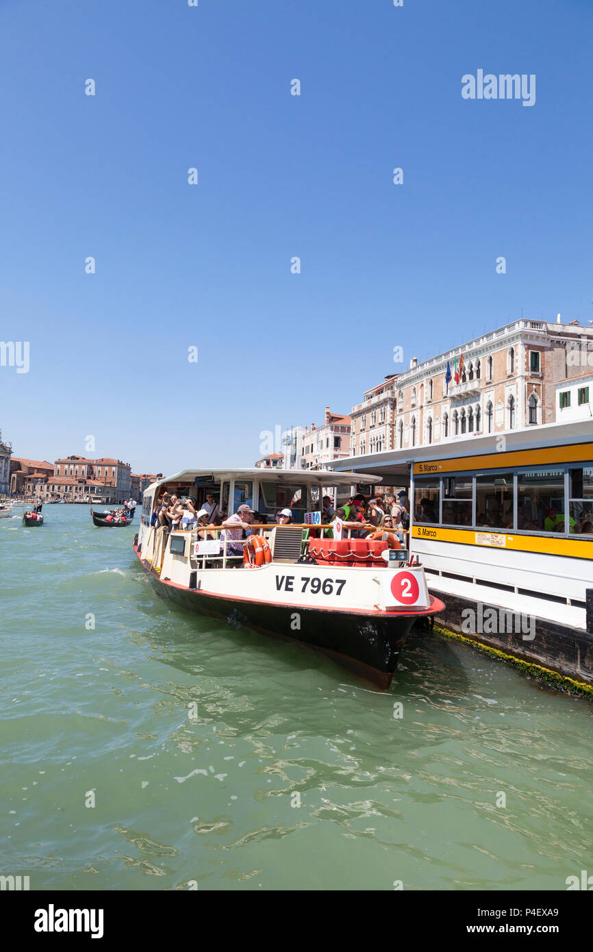 Passengers boarding a No. 2 Vaporetto waterbus at the San Marco stop on ...