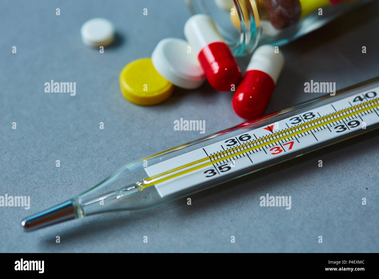 Mercury thermometer and medical pills. Top view with copy space ...