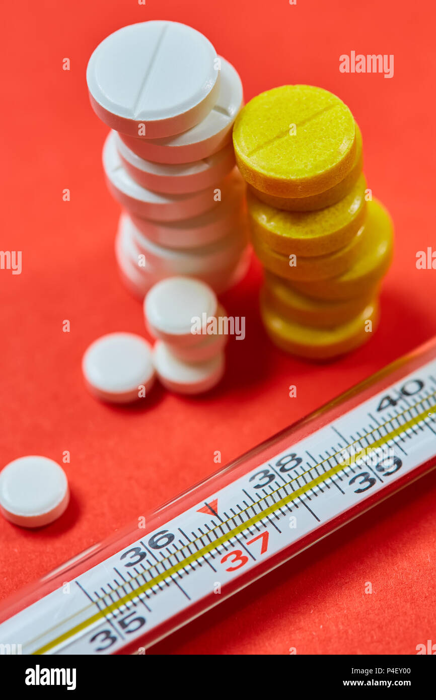 Mercury thermometer and medical pills. Top view with copy space ...