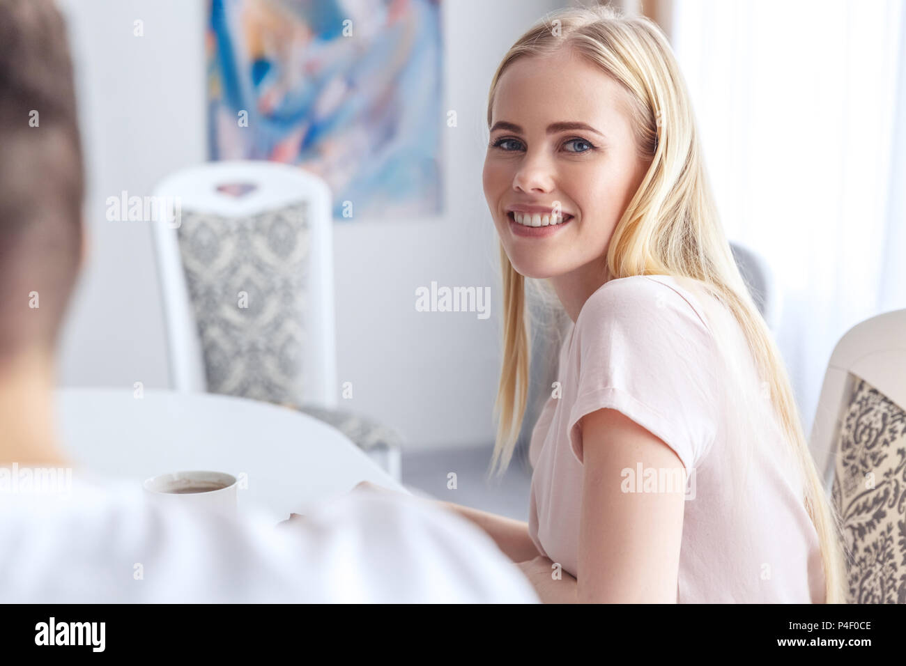Young girl smiling at camera Stock Photo - Alamy