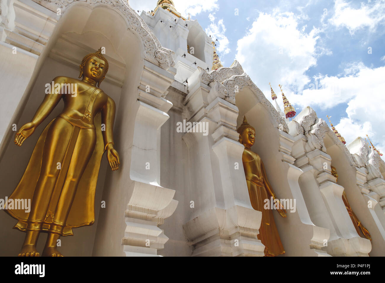 bottom view of beautiful golden buddha statues at thai temple Stock ...