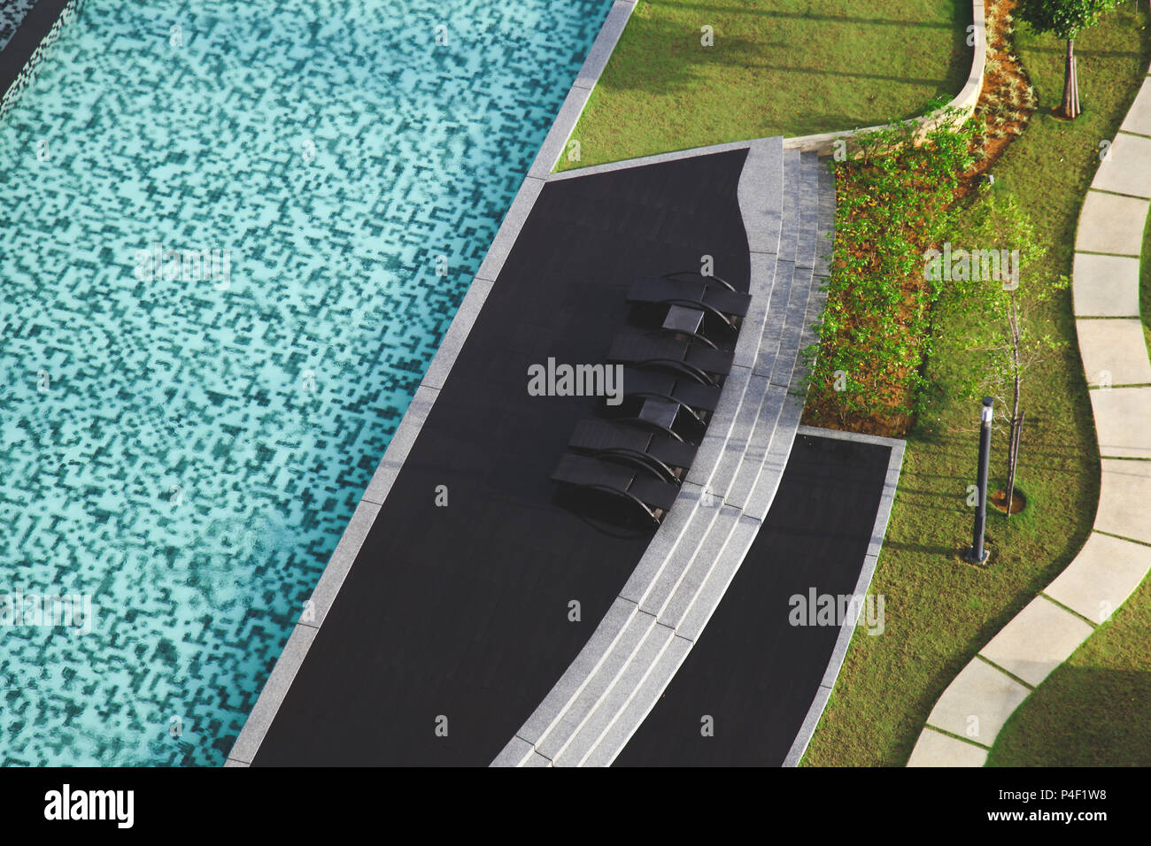 aerial view of swimming pool with sunbeds at hotel Stock Photo - Alamy