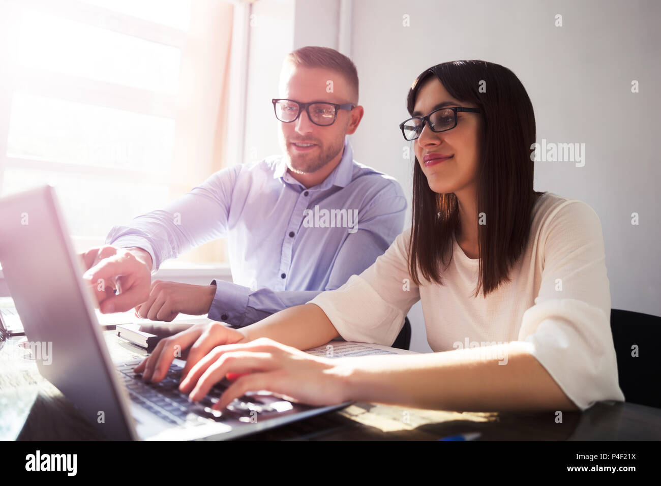 Happy businesspeople hi-res stock photography and images - Alamy