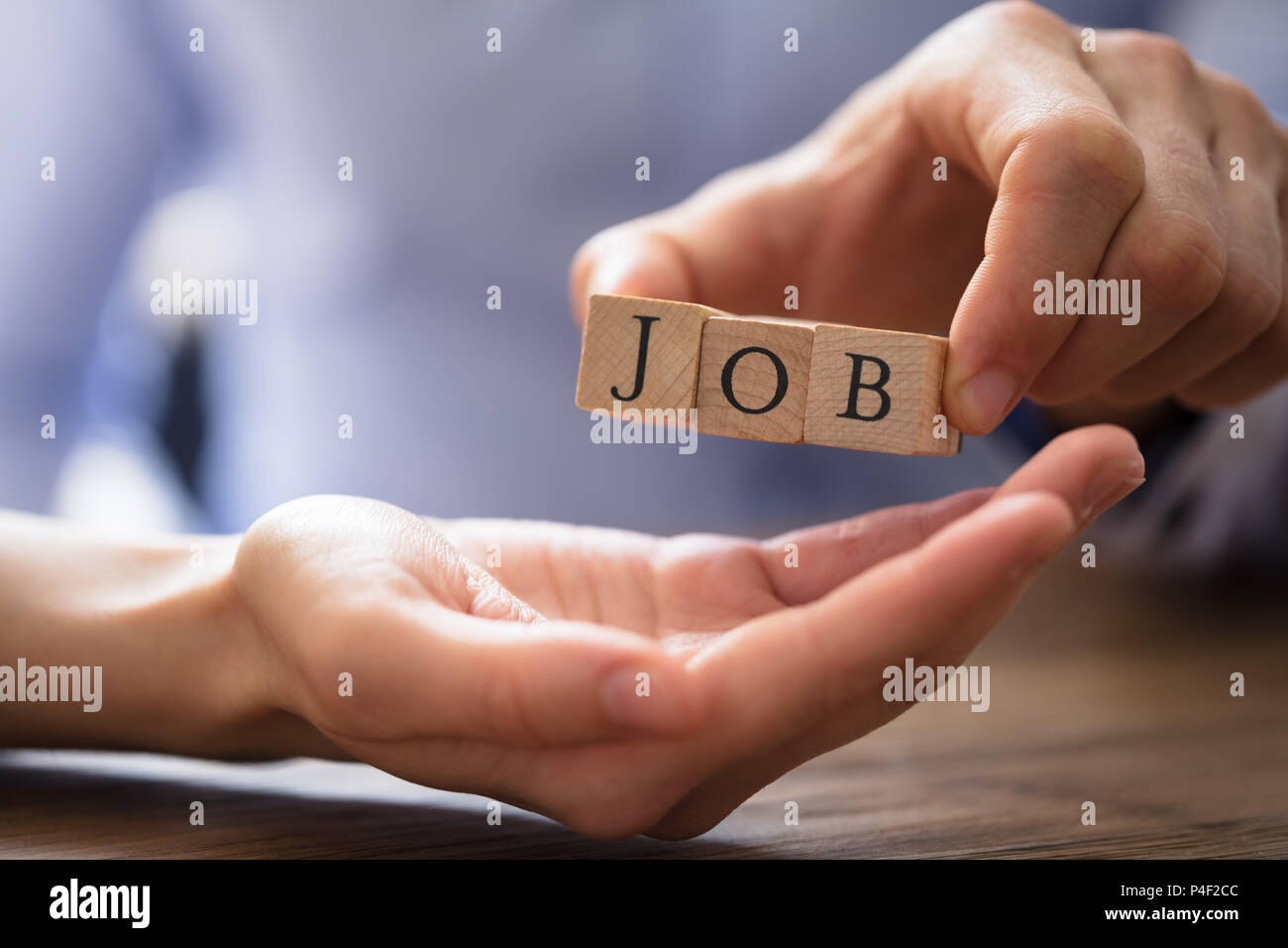 Close-up Of Businessperson's Hand Giving Wooden Block With Job Text To ...