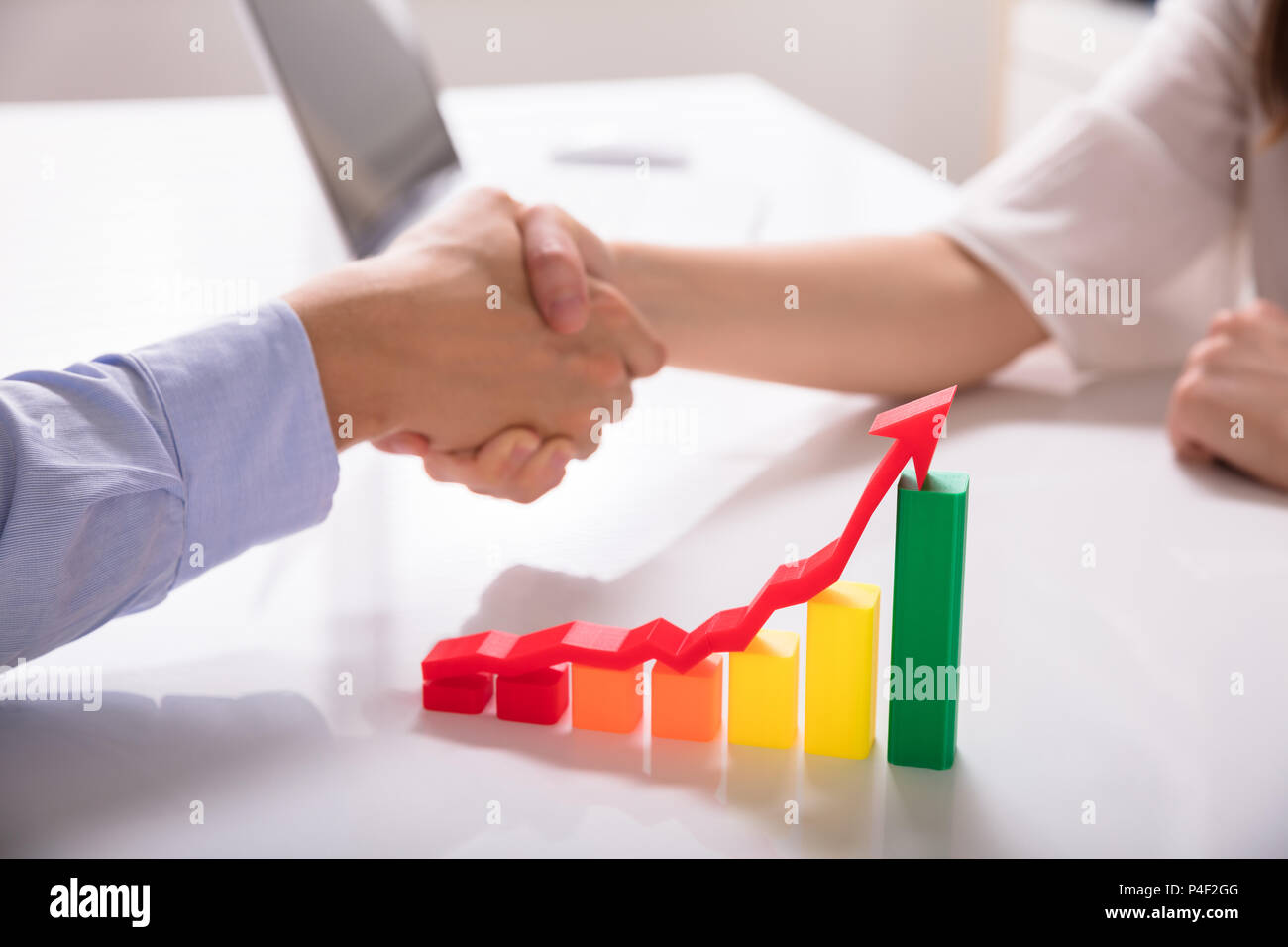 Close-up Of Increasing Multi Colored Graph With Red Arrow In Front Of ...