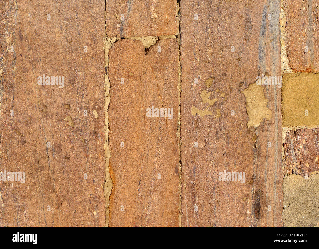 Ancient medieval yellow and brown stone block wall as background Stock ...