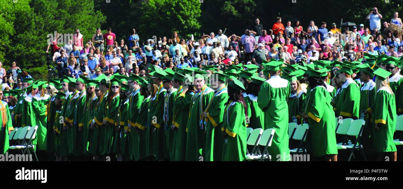 Graduates-to-be stand for the pledge of allegiance during the Prince ...