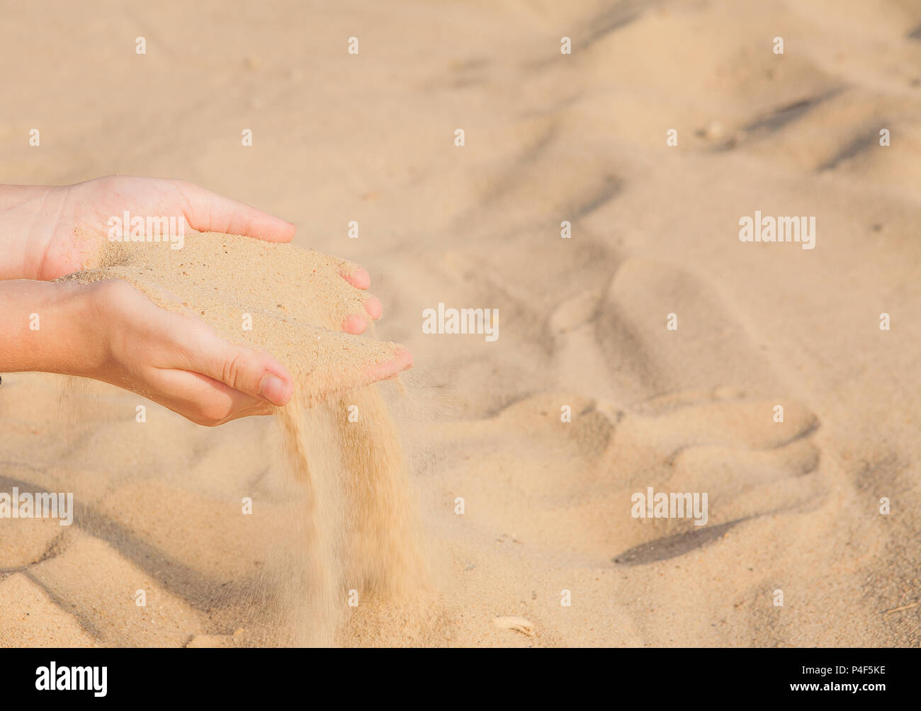 Sand Falling Through Hands High Resolution Stock Photography and Images ...