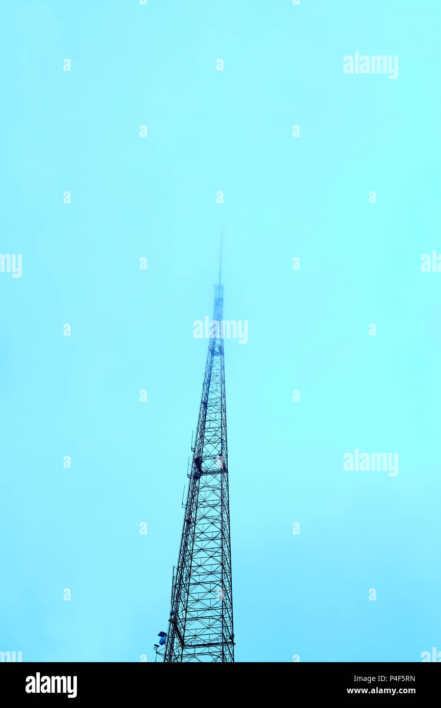 KCPTV television transmitter tower in city of Kansas with blue sky ...