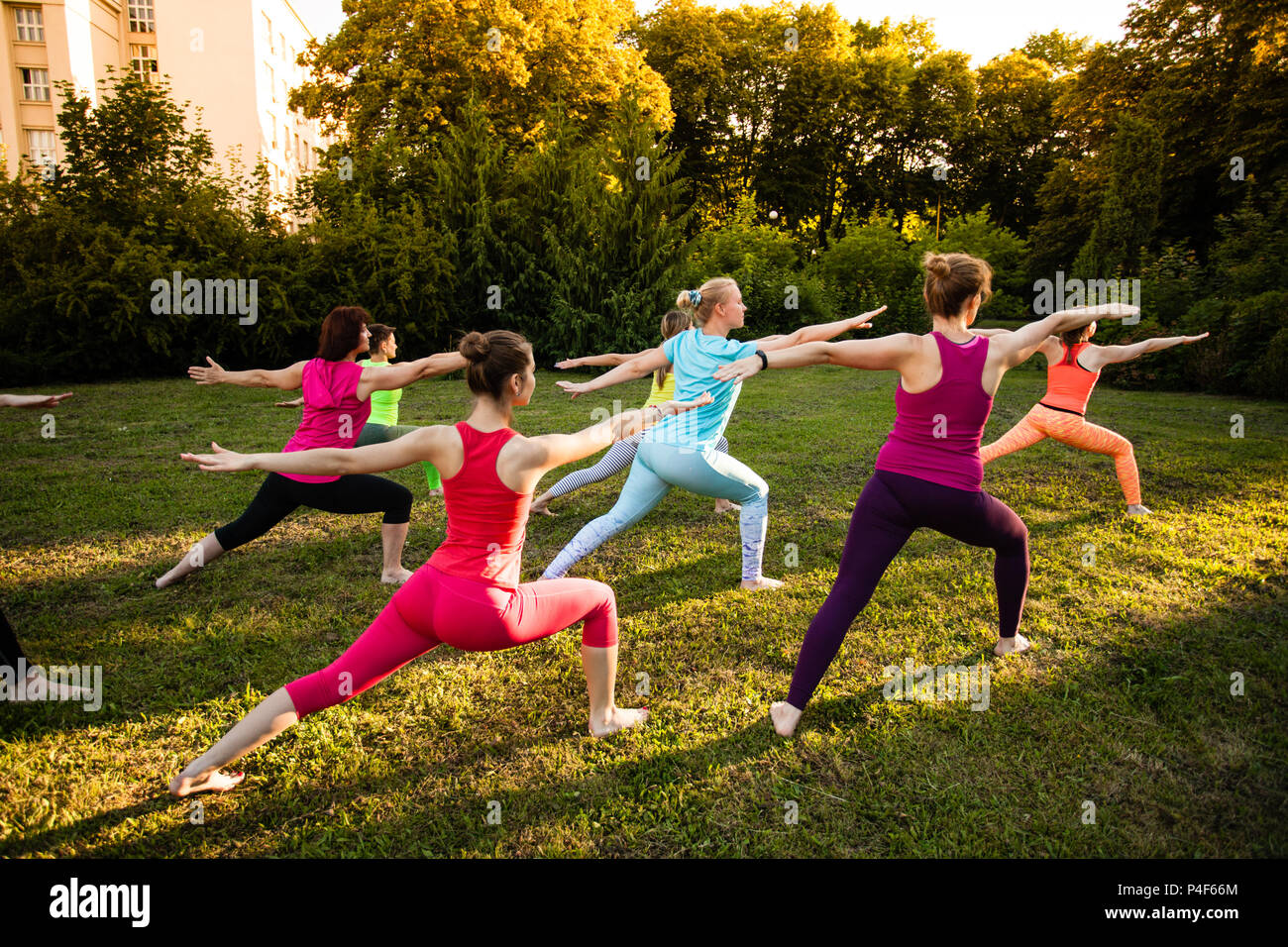 Yoga pose outside smiling group hi-res stock photography and images - Alamy