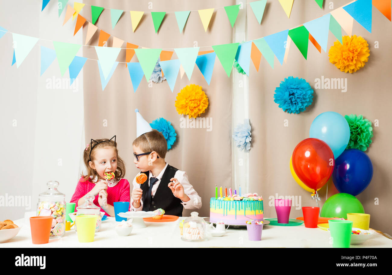 children discuss whose sweets are more delicious Stock Photo - Alamy