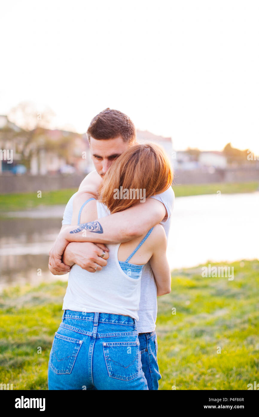 Sweet hugs of a loving couple Stock Photo - Alamy