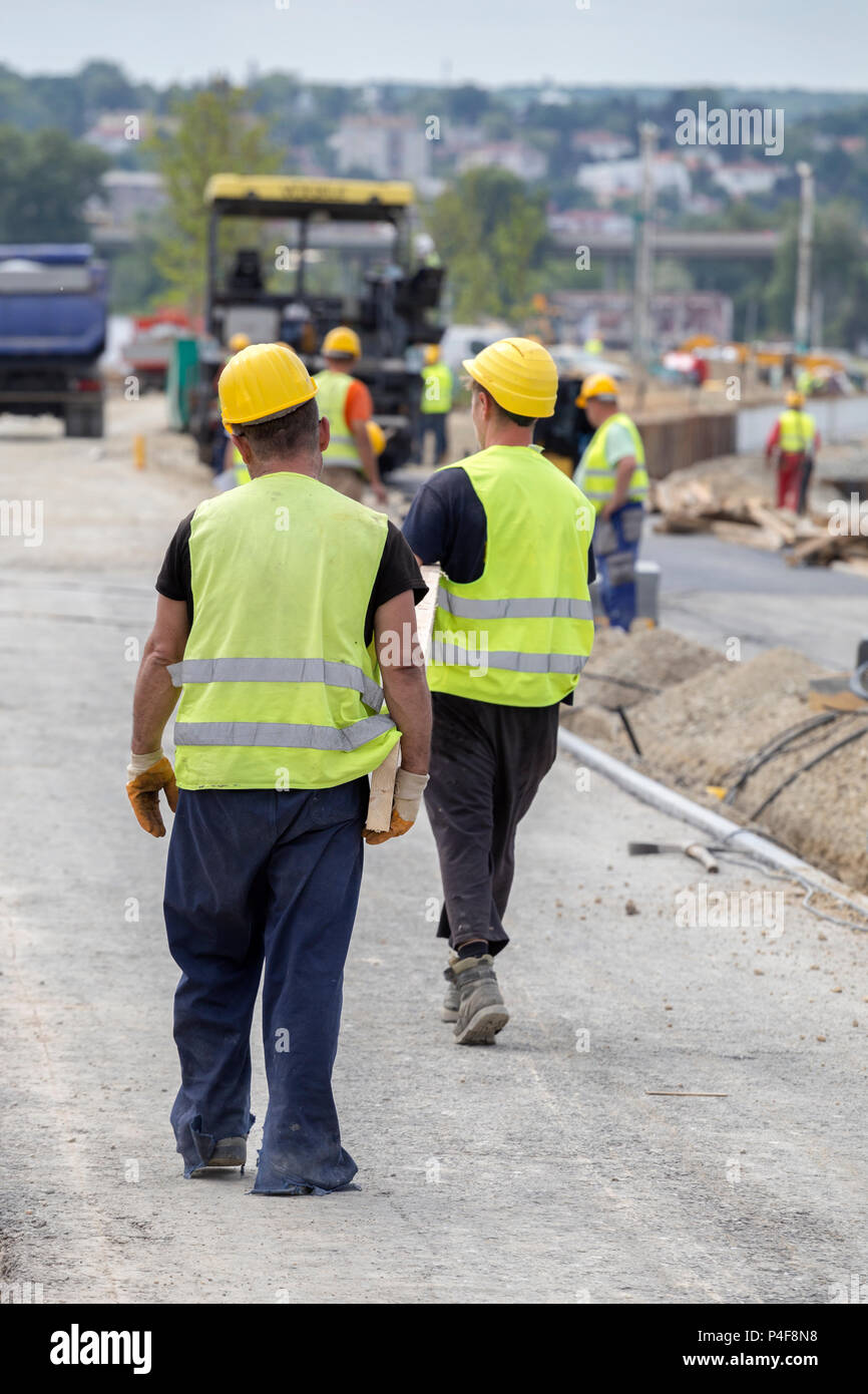 Workers carry building material construction hi-res stock photography ...