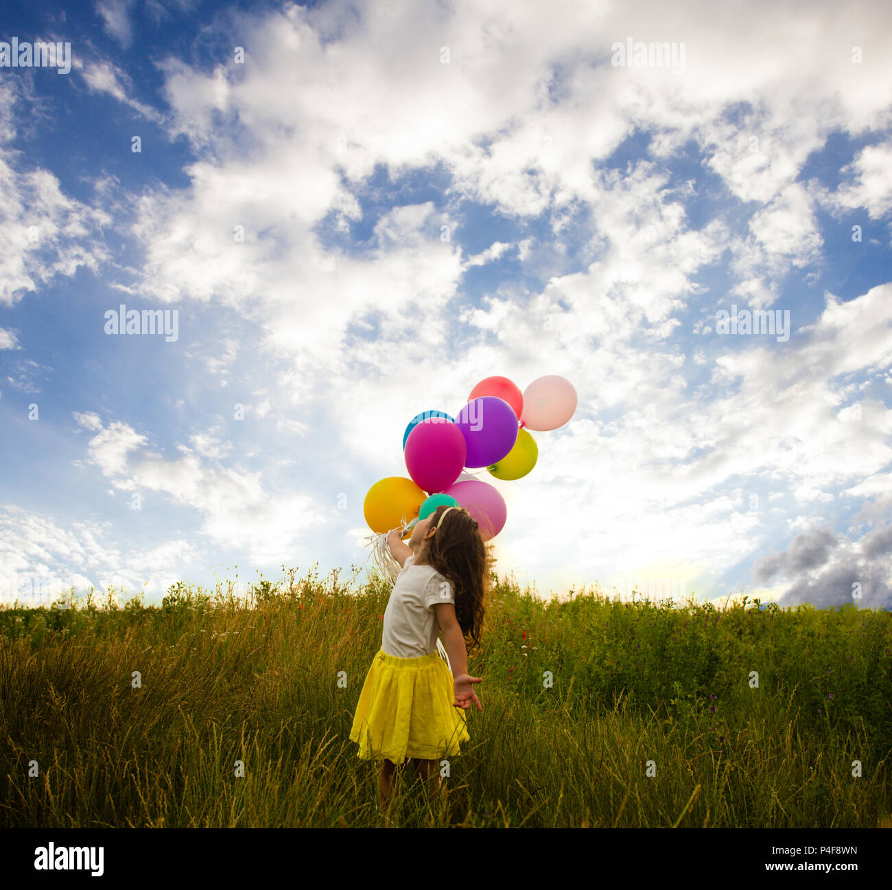 Happy child with colorful balloons Stock Photo - Alamy