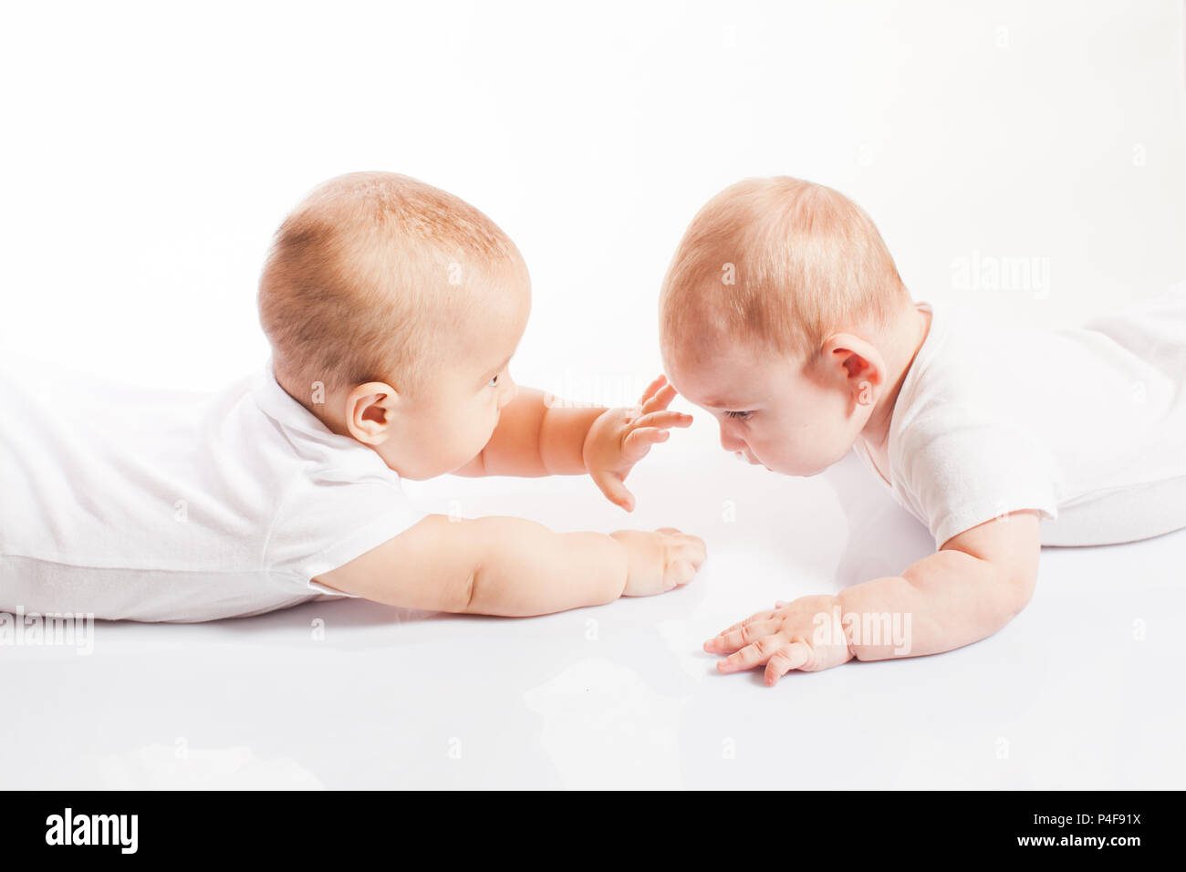cute infants playing together Stock Photo - Alamy