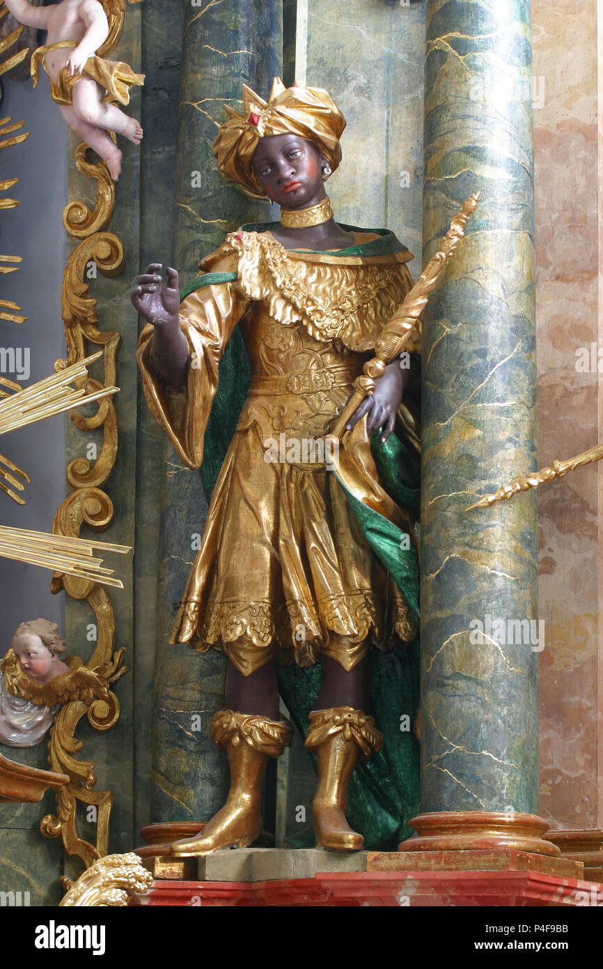 Biblical Magi Balthazar statue on the altar in the Baroque Church of ...