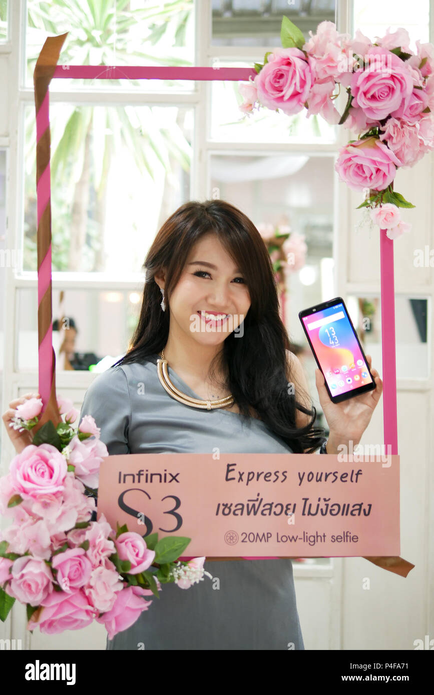 BANGKOK, THAILAND - FEBRUARY 9, 2018: Pretty girl is showing Infinix S3 ...