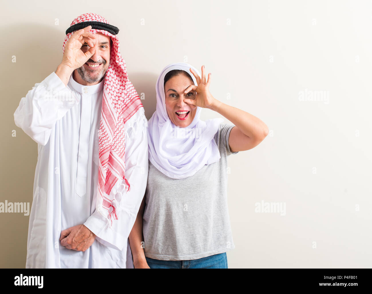 Middle age arabic couple, woman and man with happy face smiling doing ...