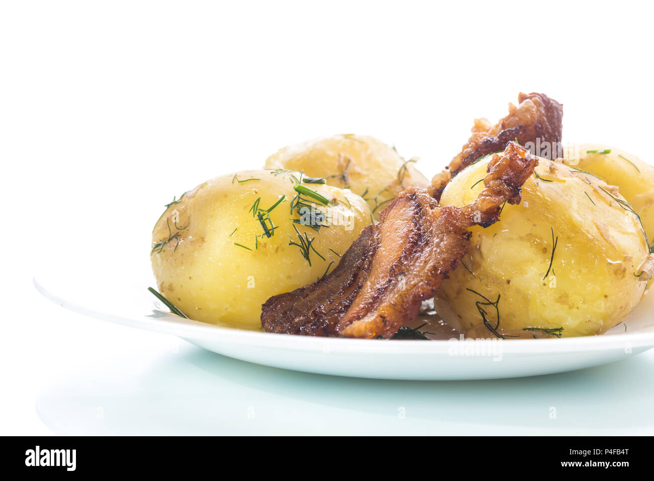 potato young boiled with fried bacon Stock Photo - Alamy
