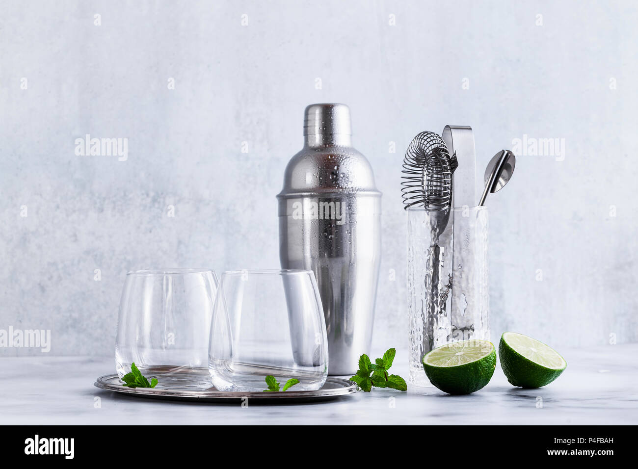 bar accessories on the table and two glasses of ice. tools for the ...