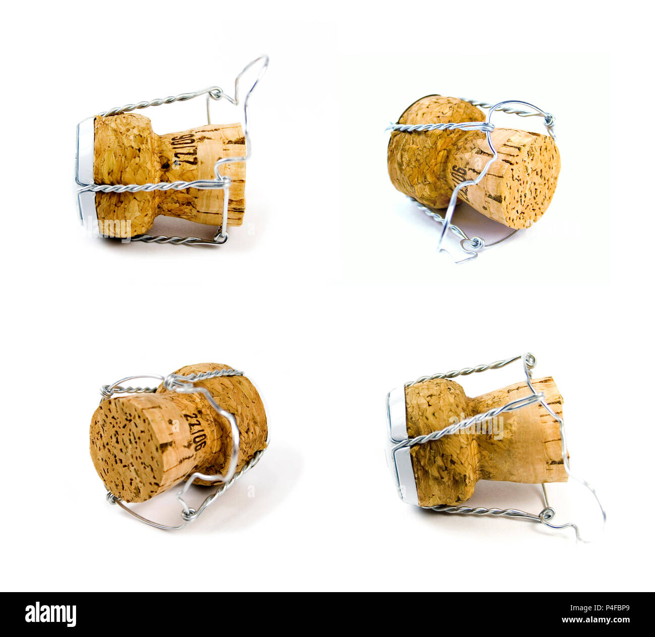 four champagne corks on white background Stock Photo - Alamy