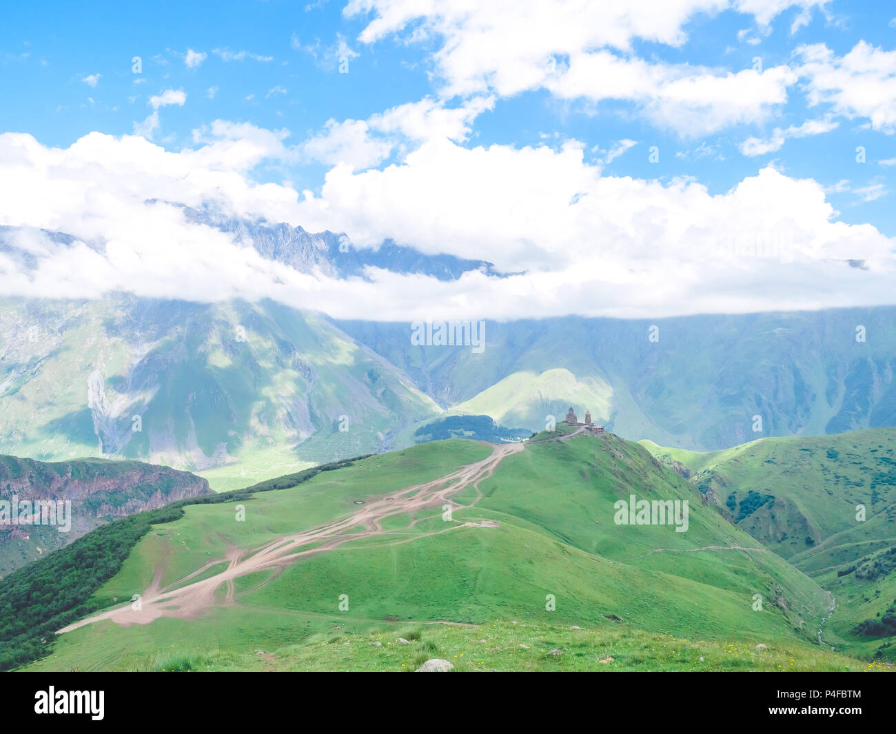 scenic mountain landscape and Holy Trinity Church in Georgia Stock ...