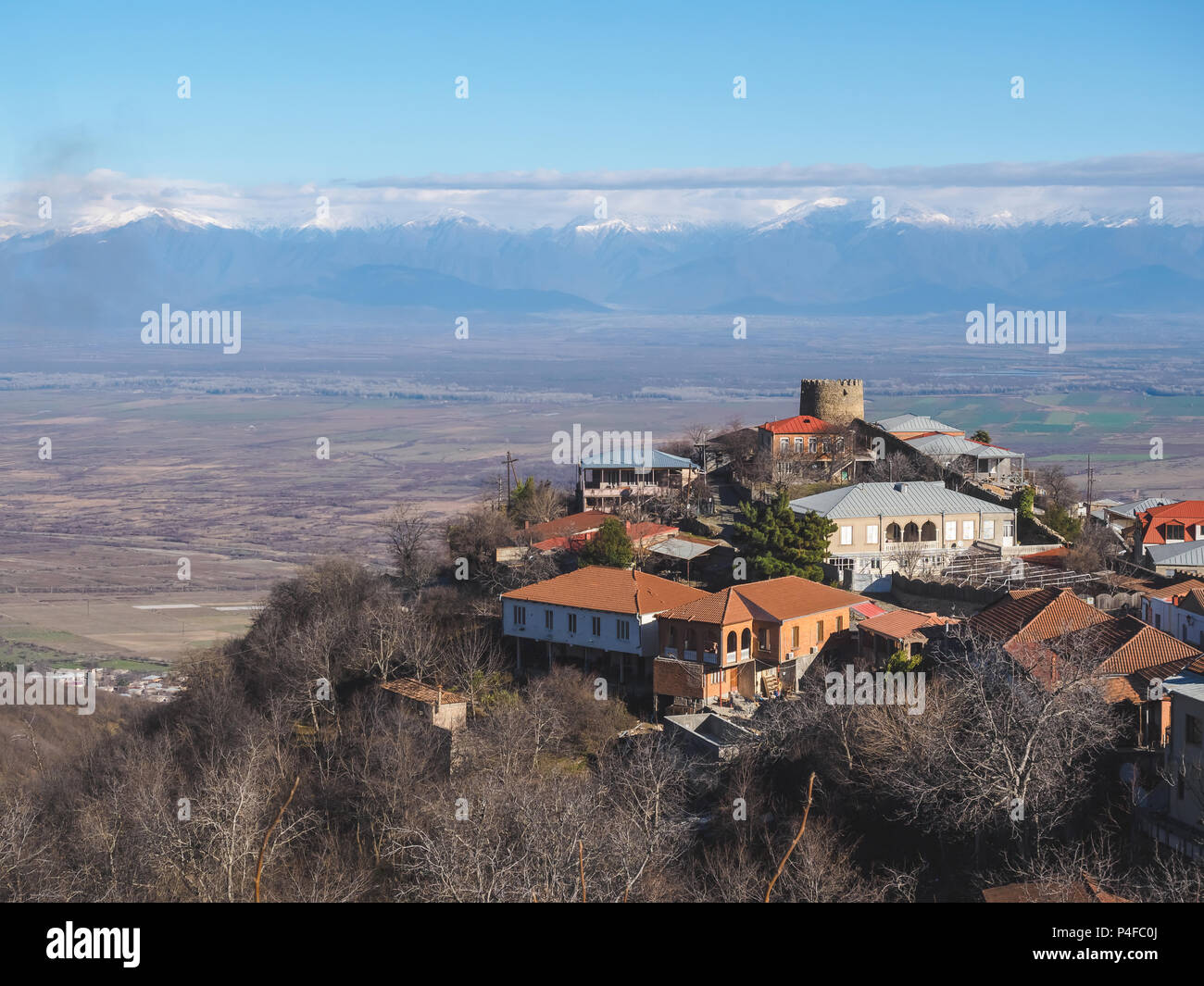 aerial view of buildings and beautiful mountains in Signagi, Georgia ...