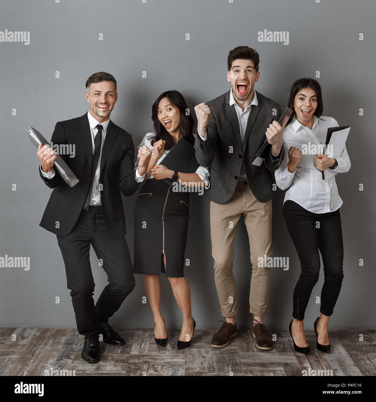 happy multicultural business people with folders and notebooks standing ...