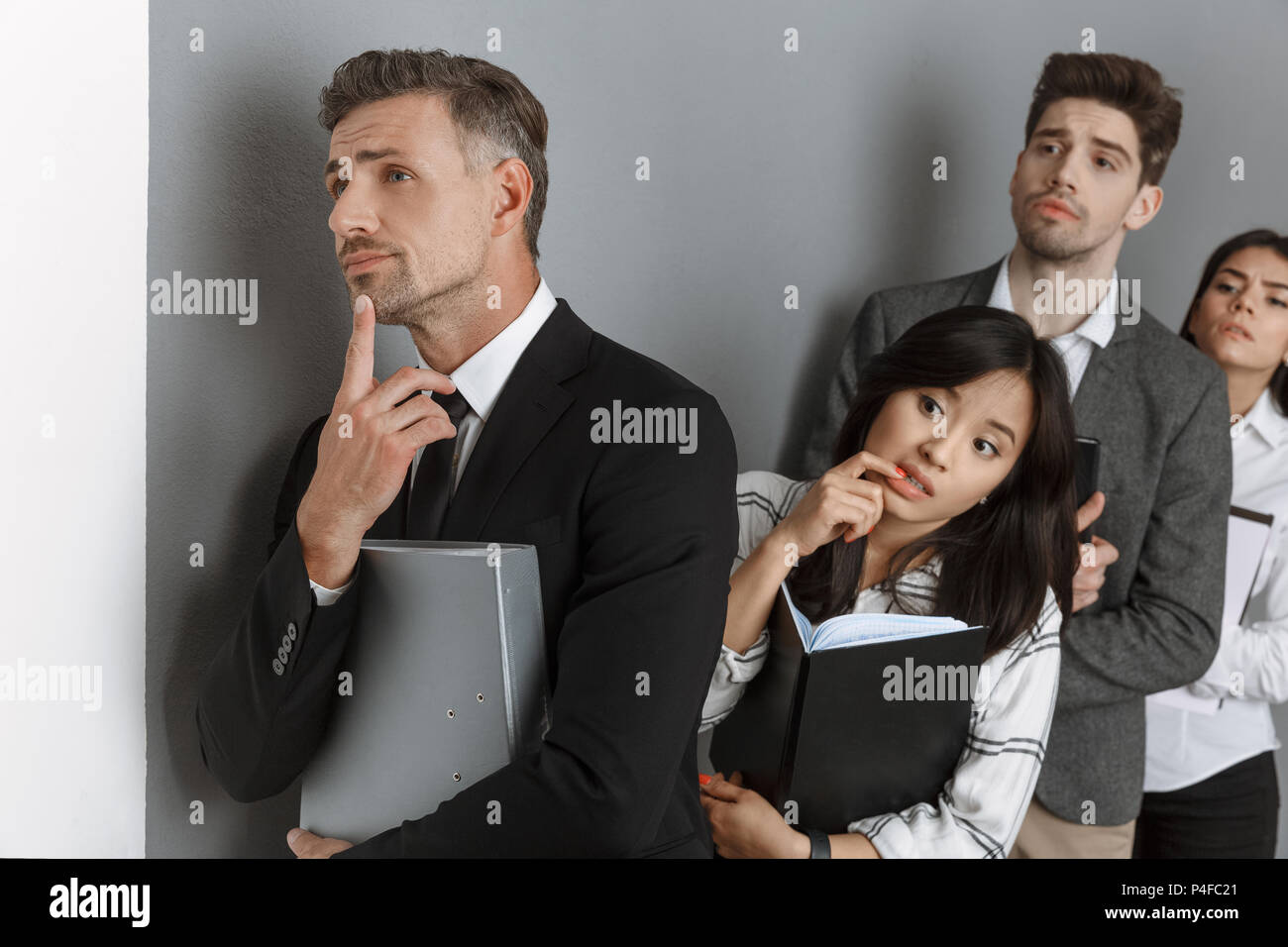 multicultural business people with folders and notebooks standing in ...