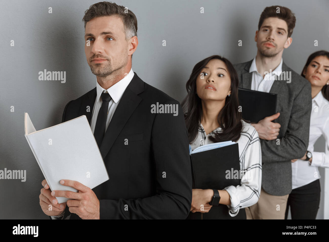 multicultural business people with folders and notebooks standing in ...