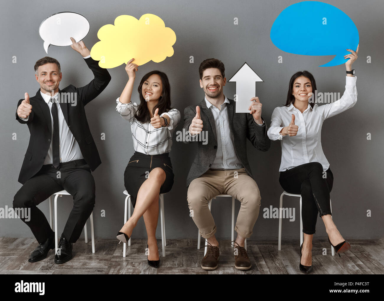 multiethnic business people with paper chat bubbles and arrow showing ...