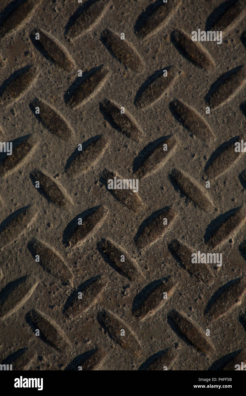 Closeup of distressed, mottled, grungy industrial checker plate rusty ...