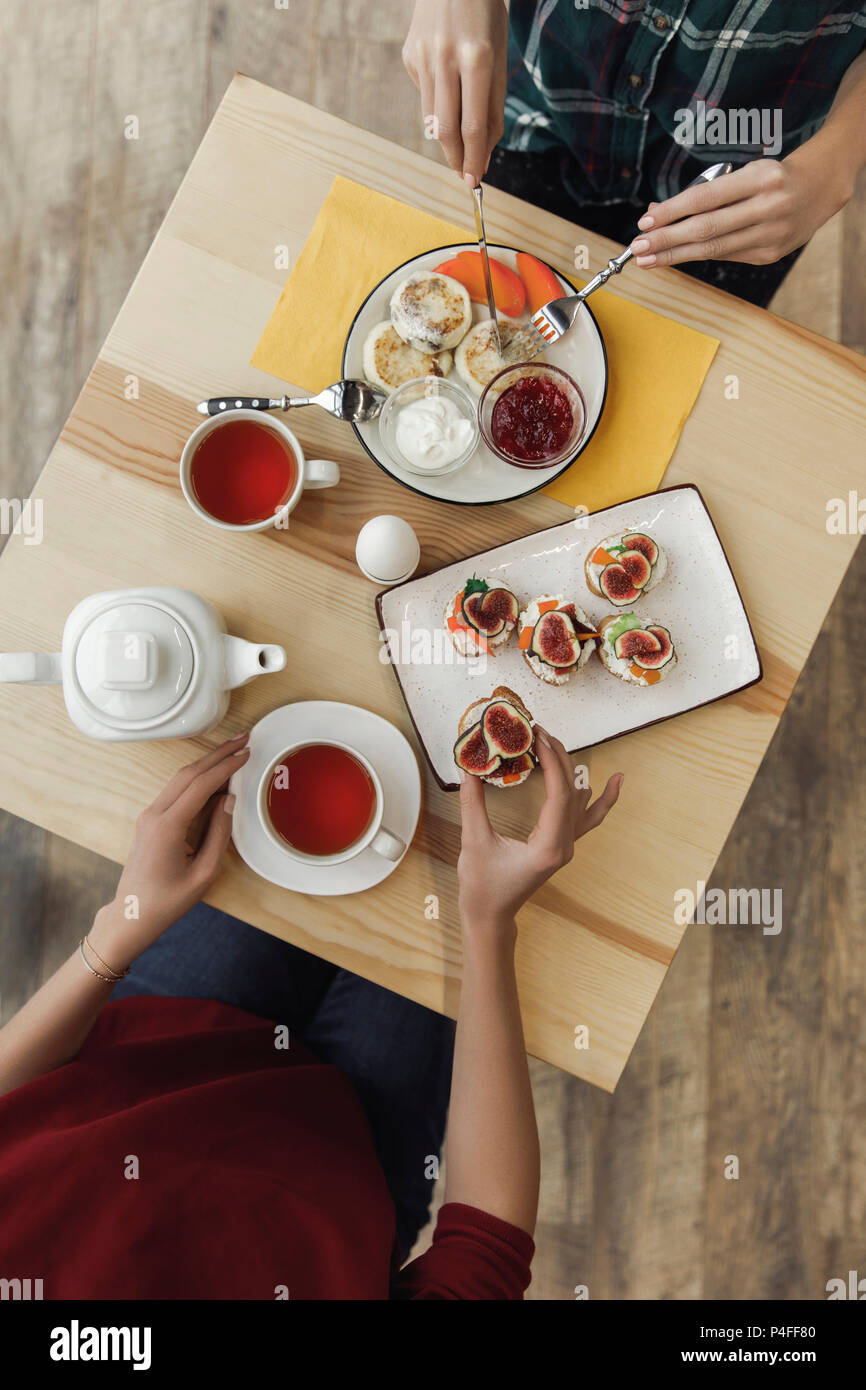 top view of two people having breakfast together Stock Photo - Alamy