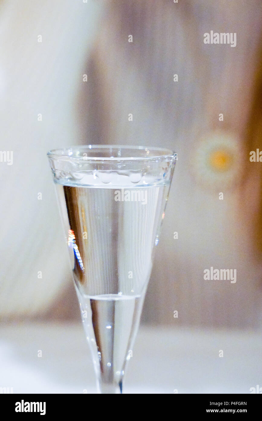 Grappa in akvavit glass, lady in background with Daisy pendant from ...